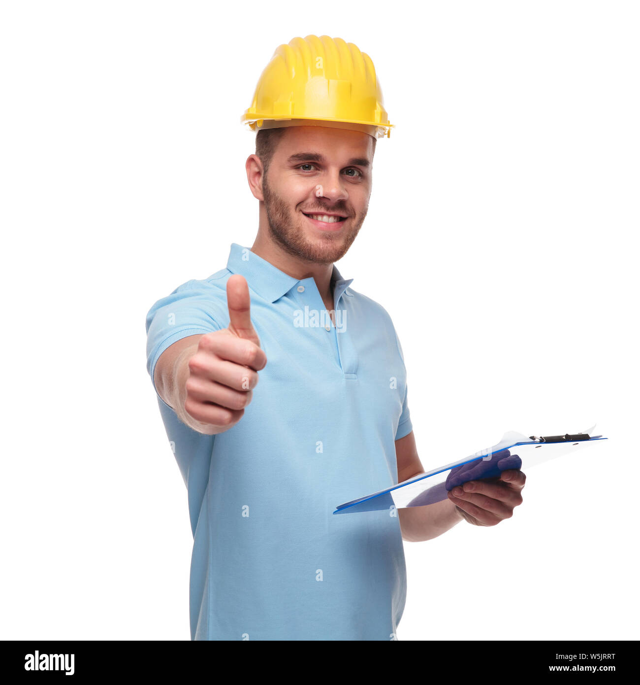 handsome engineer student makes thumbs up sign while holding blue files ...
