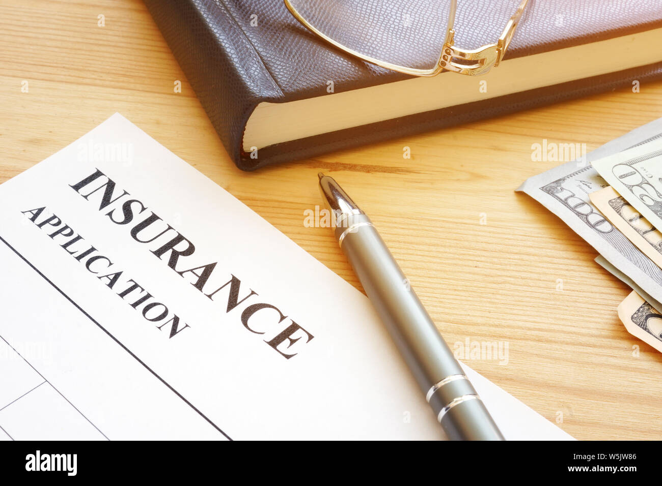 Insurance application form and pen for signing Stock Photo - Alamy