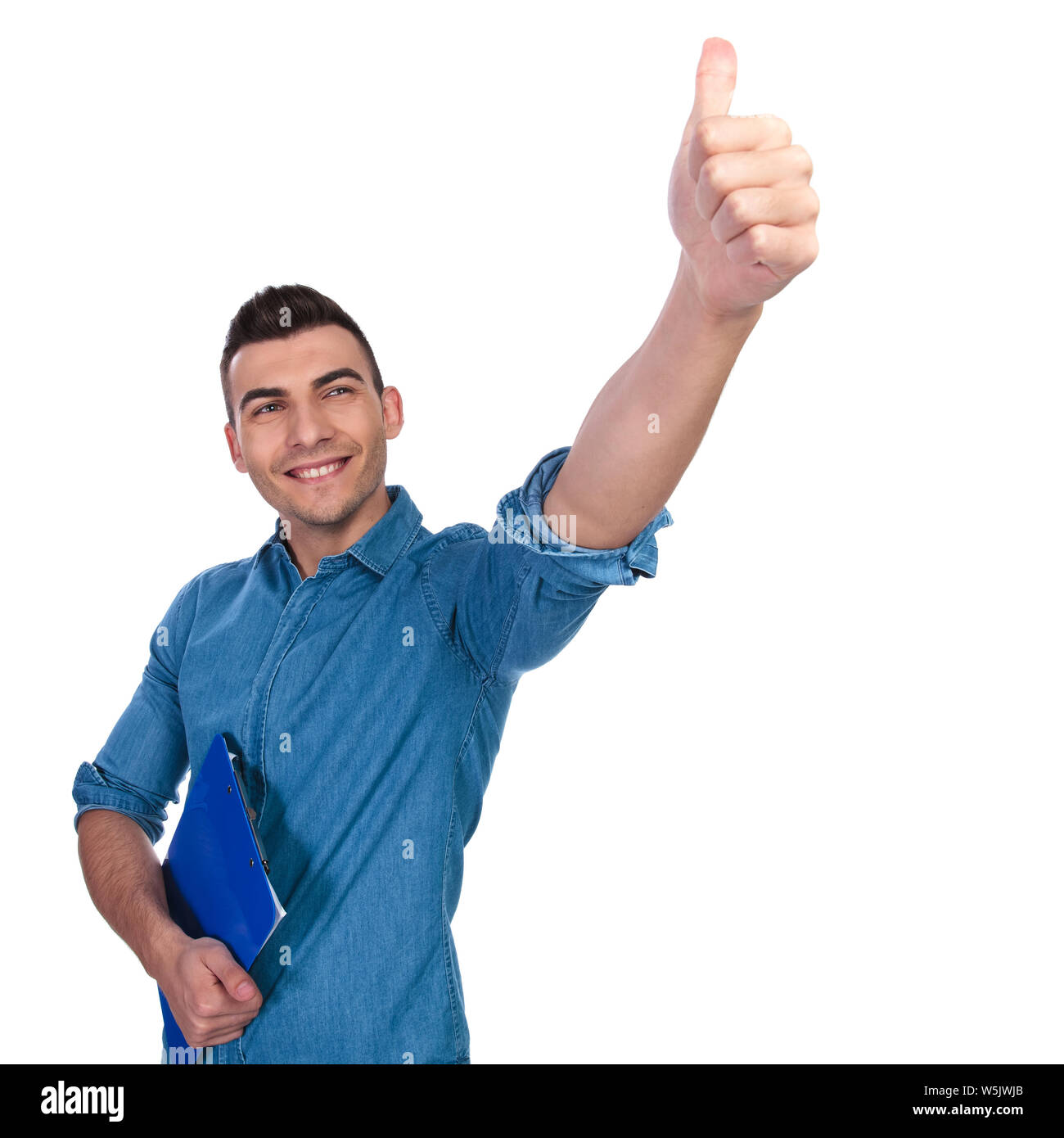 joyful casual man makes ok sign while looking up to side, portrait ...