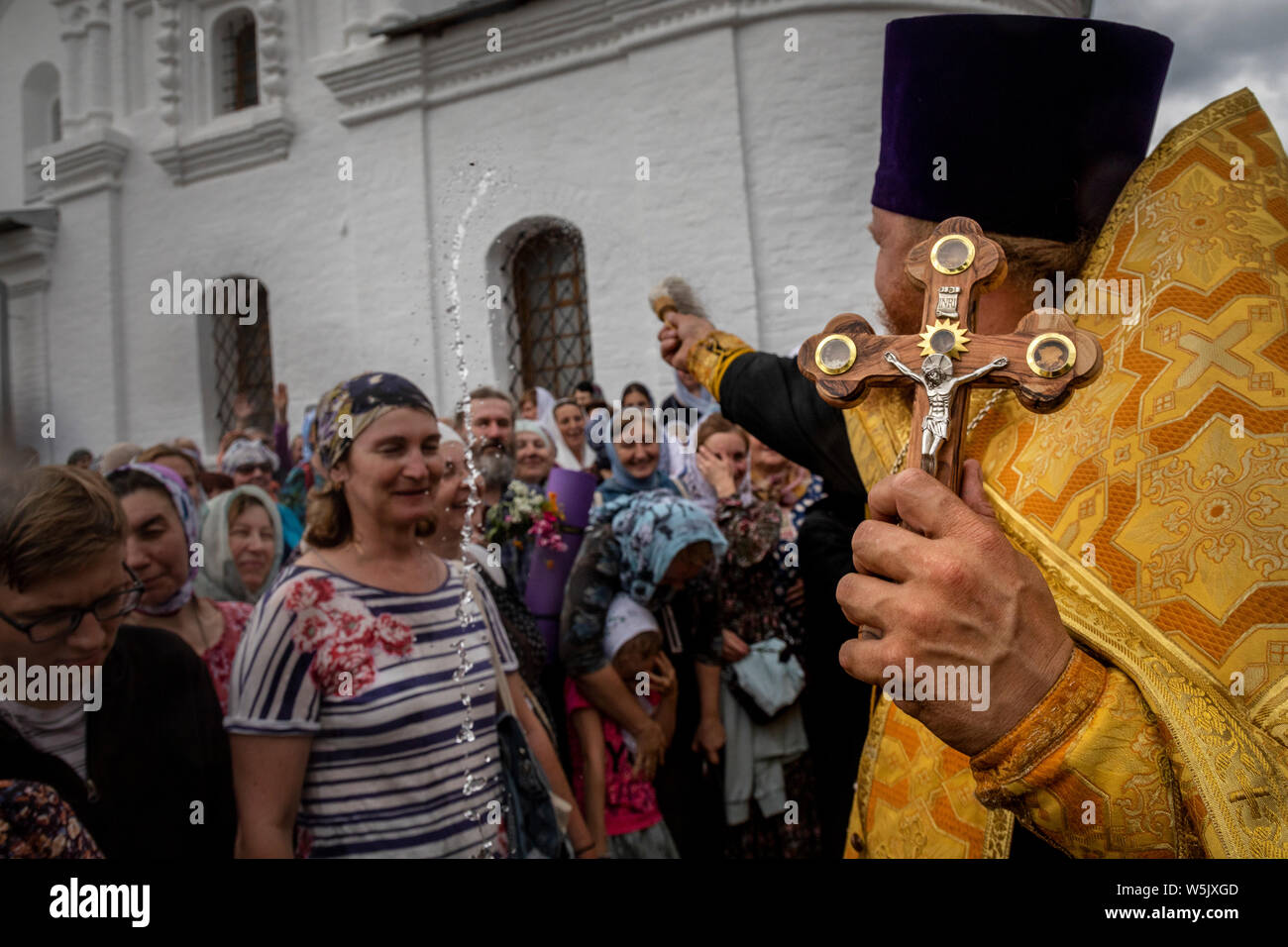 Orthodox priest sprinkles holy water hi-res stock photography and ...