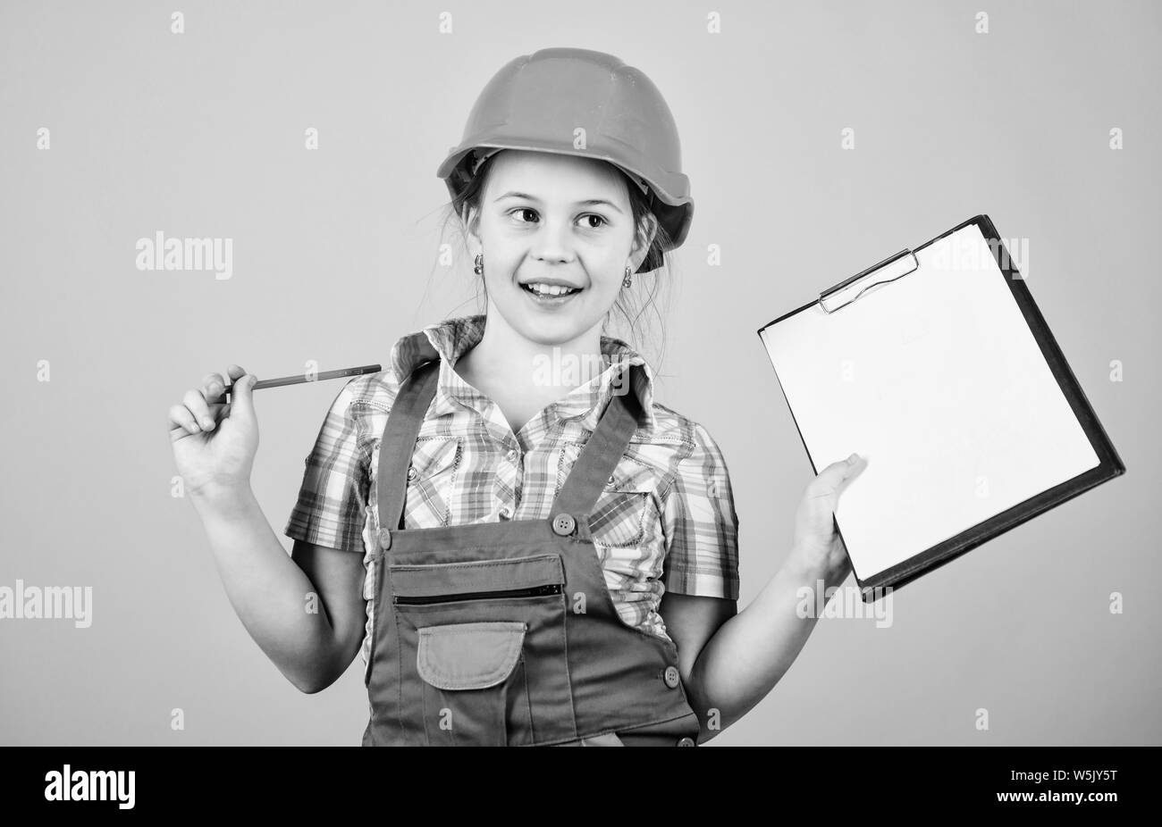 Foreman inspector. Repair. small girl repairing in workshop. Child care ...