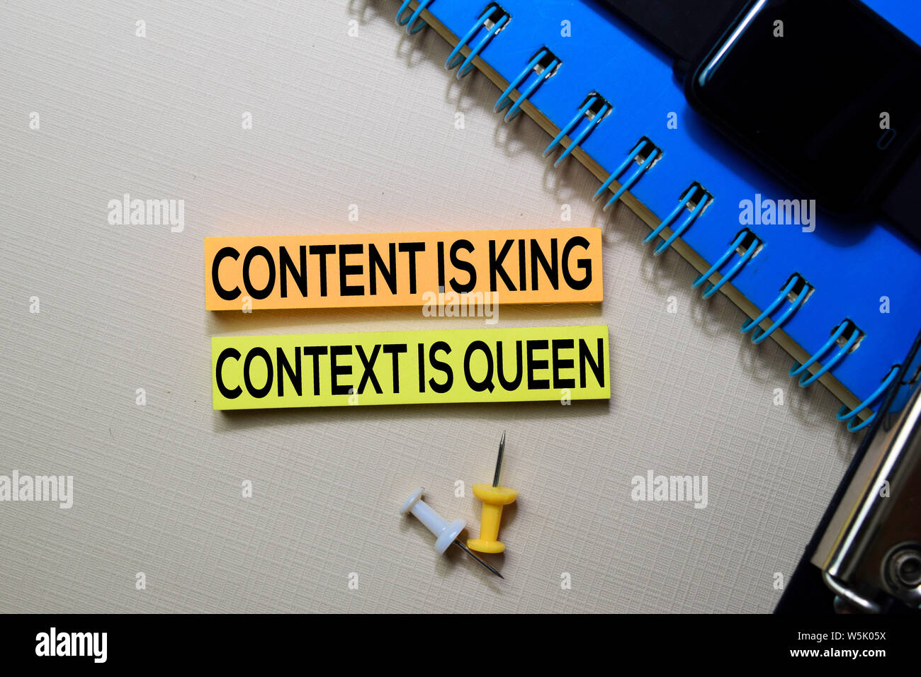 Content is King. Context Is Queen text on sticky notes isolated on ...