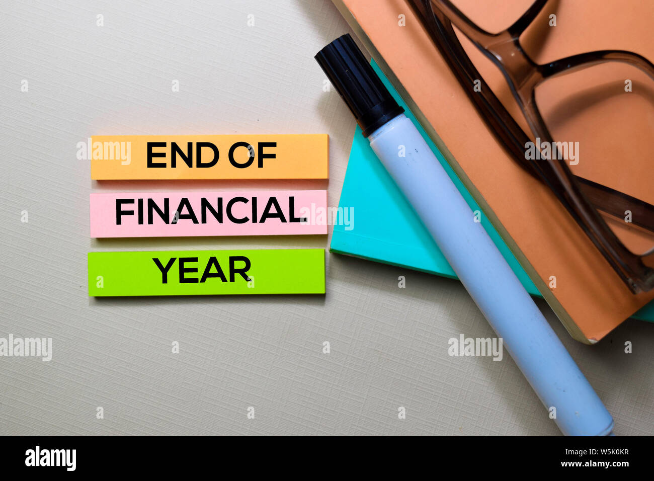 End of Financial Year text on sticky notes isolated on office desk ...