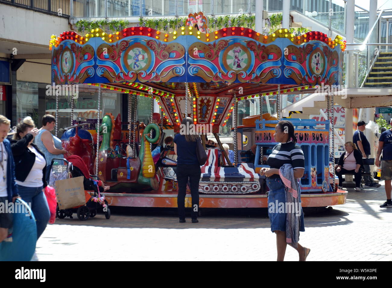 Children on a roundabout at a fun fair hi-res stock photography and ...