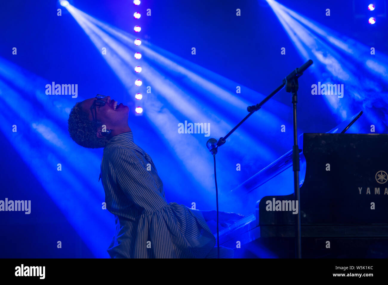 Woman singing playing piano hi-res stock photography and images - Alamy