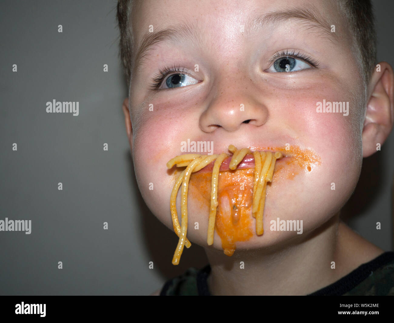 Boy eating messy spaghetti dinner hi-res stock photography and images ...