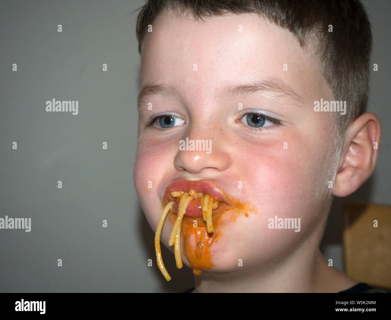 Boy eating messy spaghetti dinner hi-res stock photography and images ...