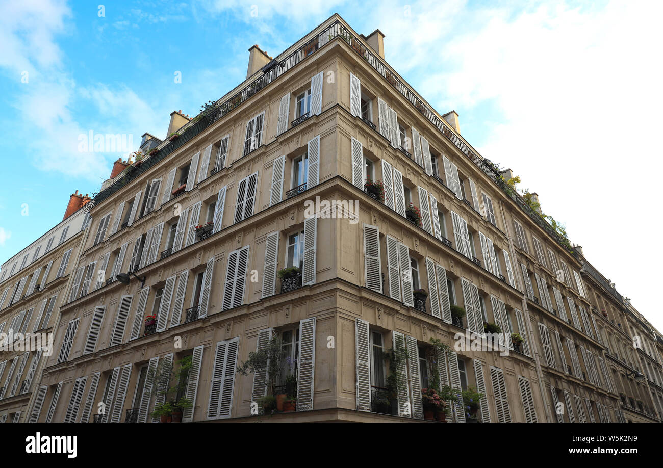 Traditional French house with typical balconies and windows. Paris ...