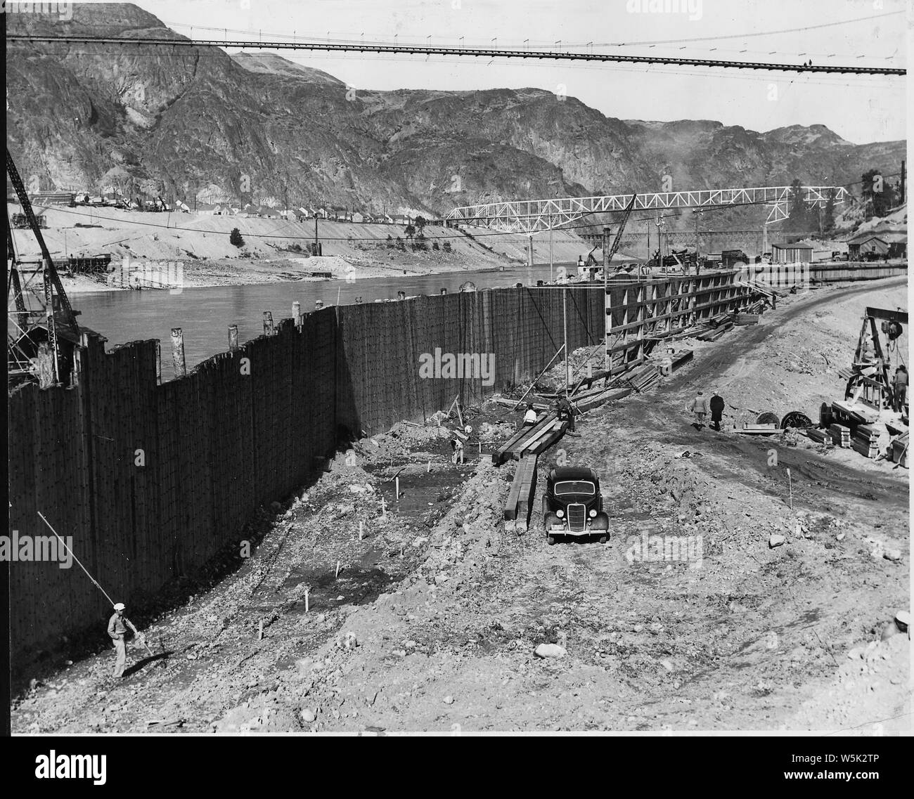 Back of the west cofferdam, under construction. Sand and gravel bridge ...