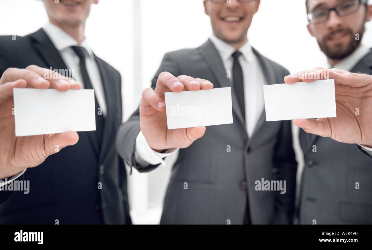three business partners showing their business card form Stock Photo ...