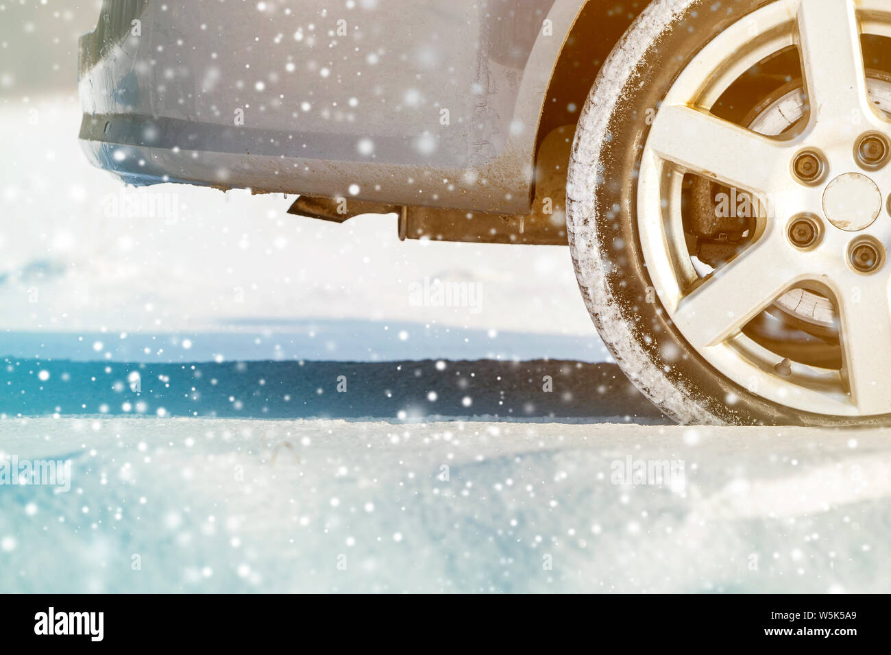 Close-up of car wheels rubber tires in deep winter snow. Transportation ...