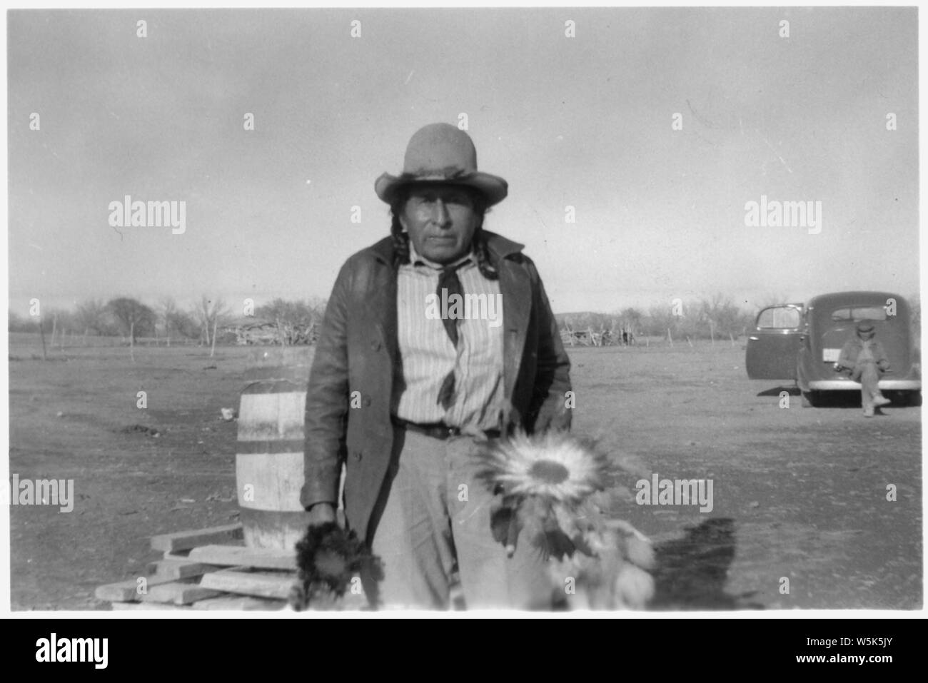 Bob Good Horse holds a sunflower Stock Photo - Alamy