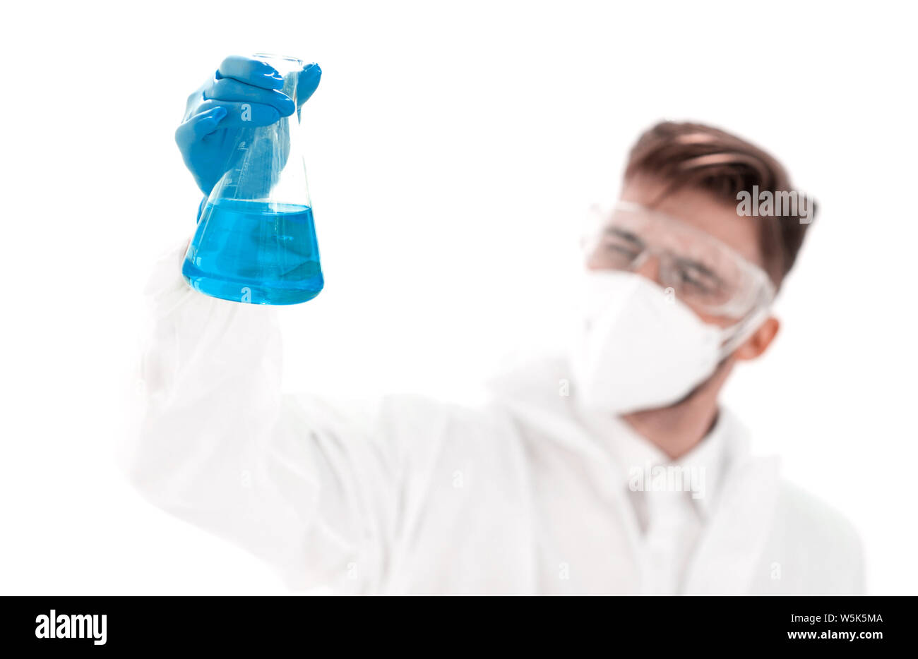 modern scientist examining the liquid in the flask Stock Photo - Alamy