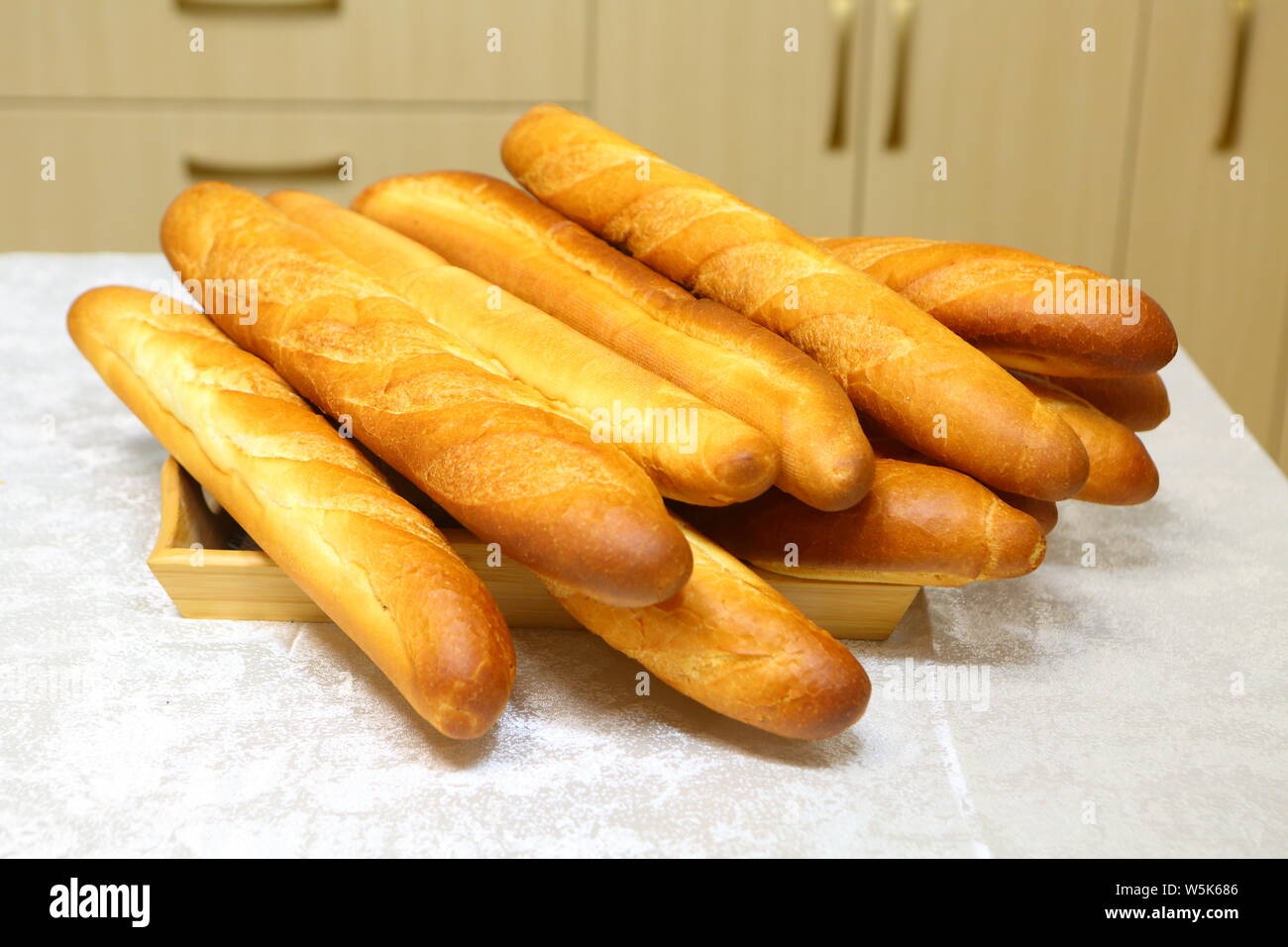 French loaves on the kitchen table Stock Photo - Alamy