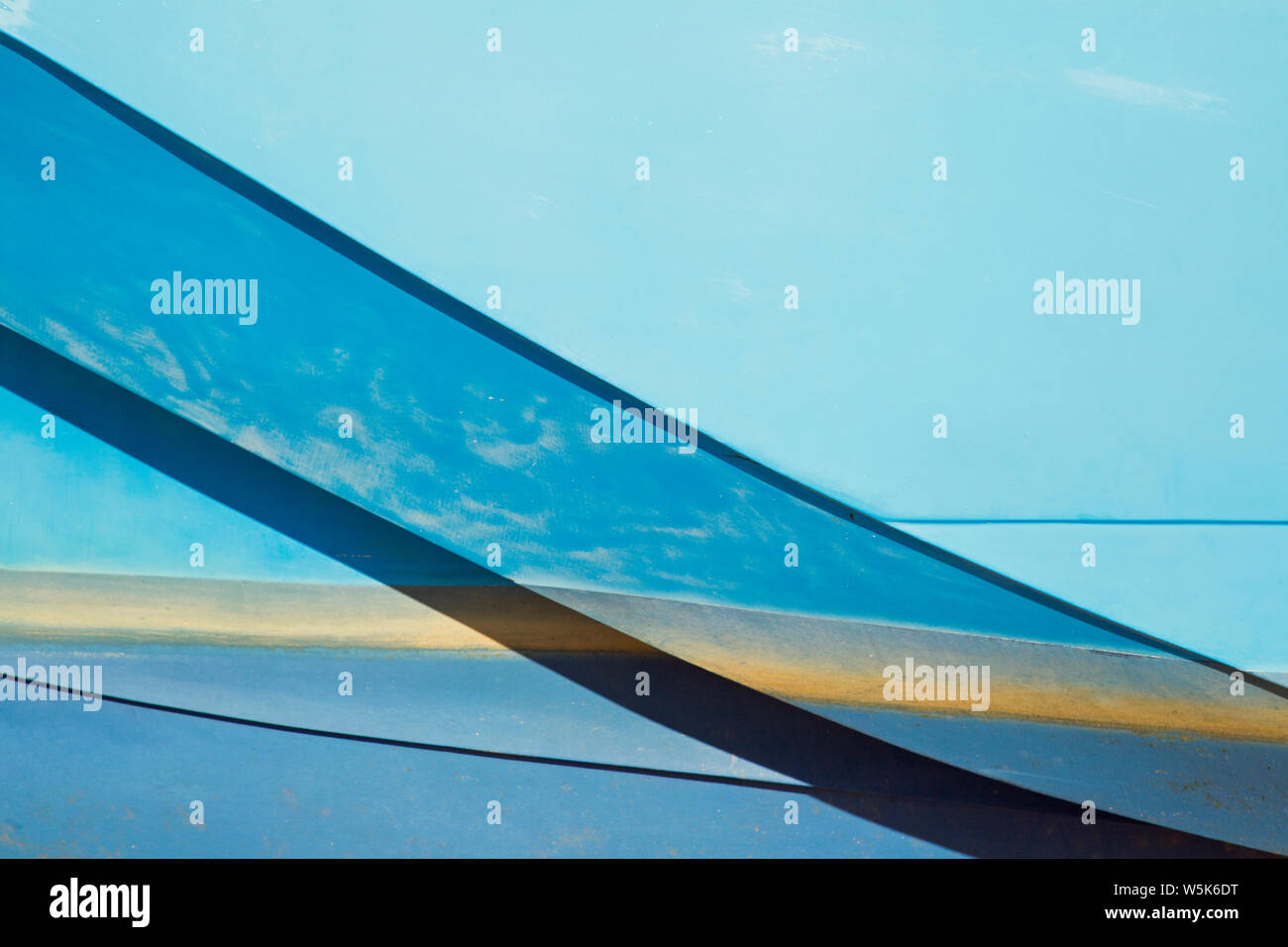 Close up on the hull of a blue boat, texture background shot in ...