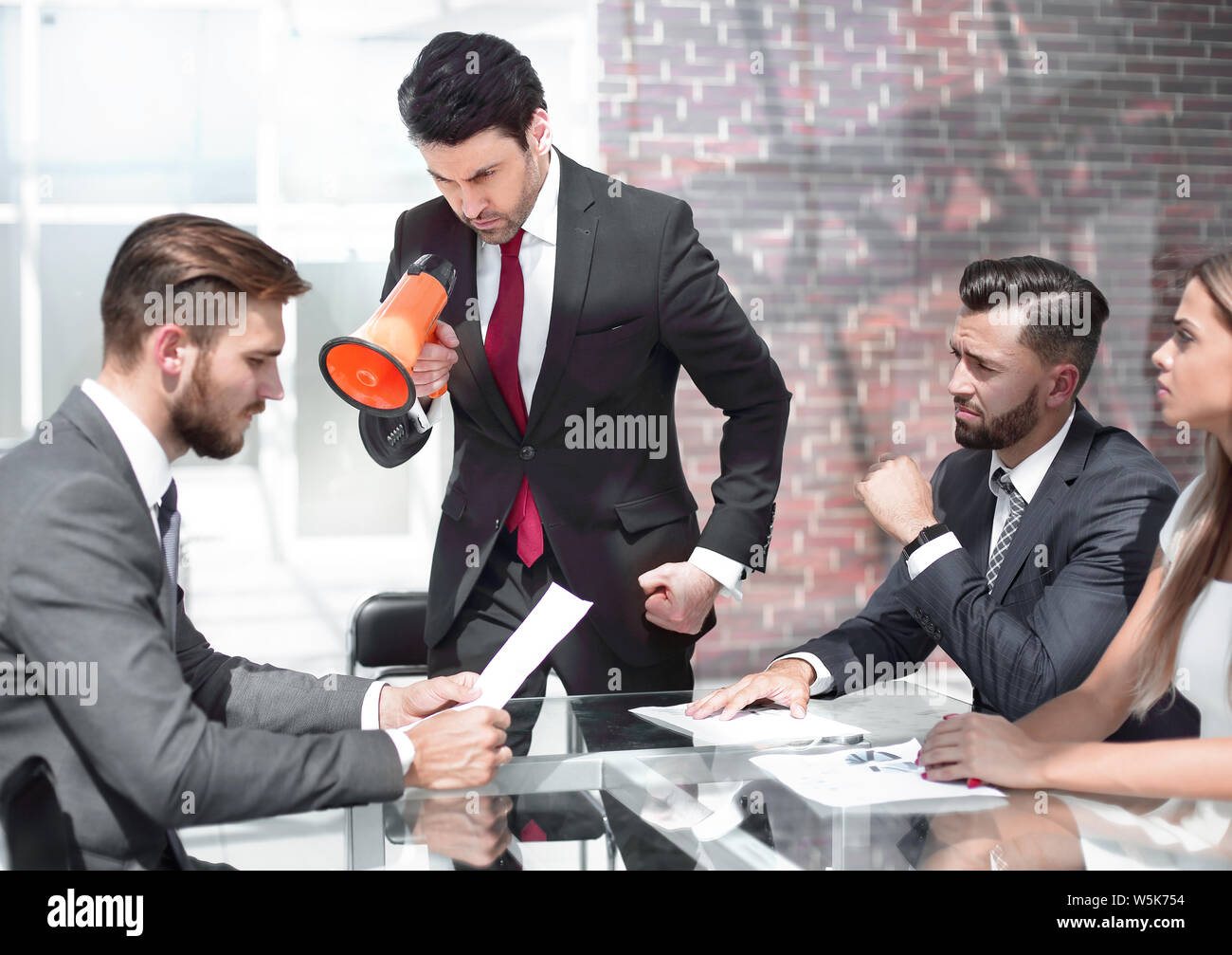 boss screams through the megaphone in the office Stock Photo - Alamy