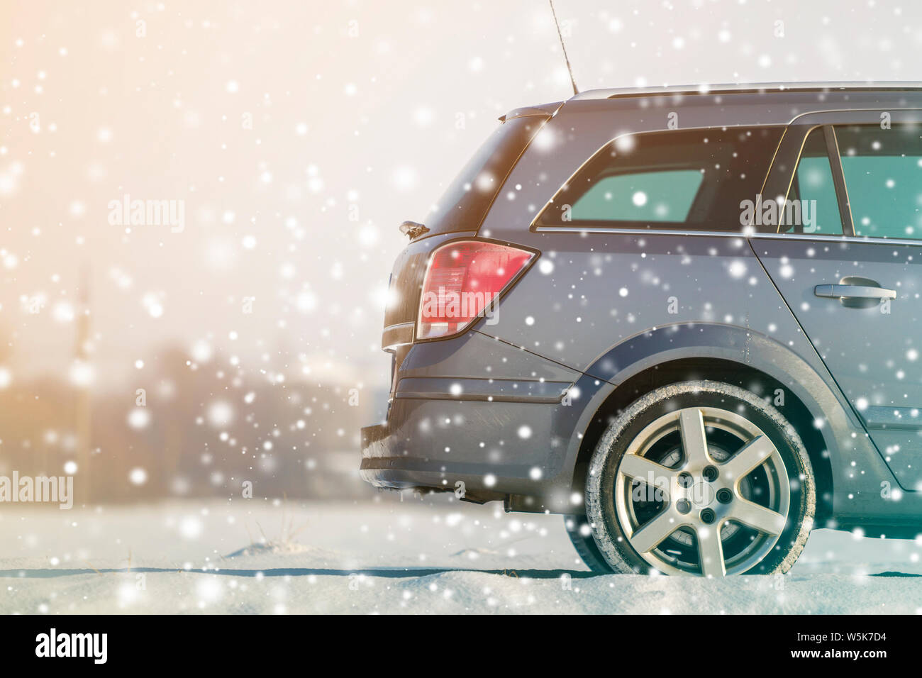 Close-up of car wheels rubber tires in deep winter snow. Transportation ...