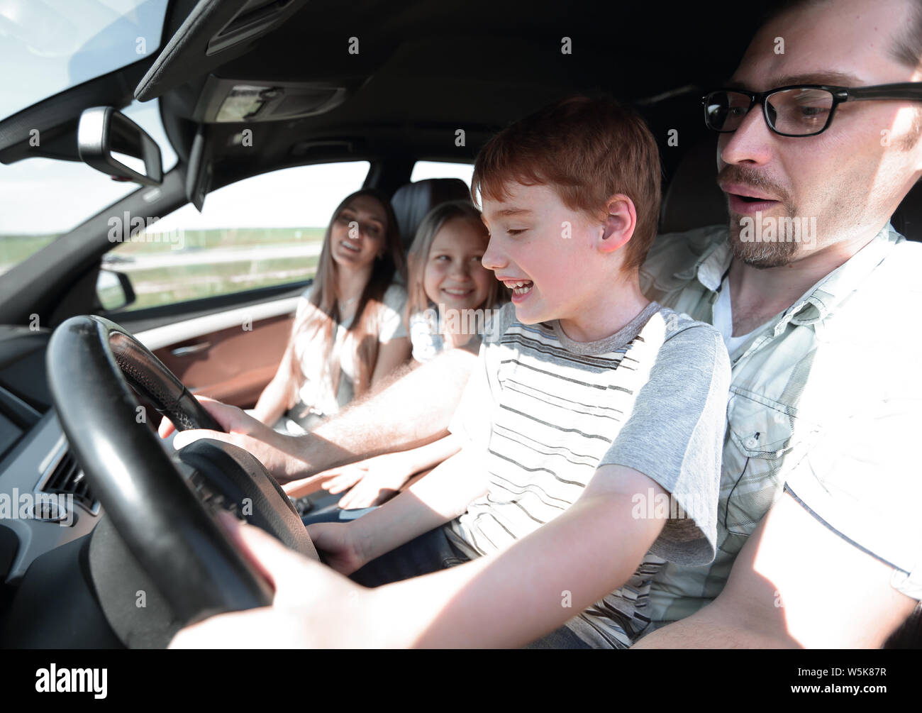 funny father and his little son driving a car Stock Photo - Alamy