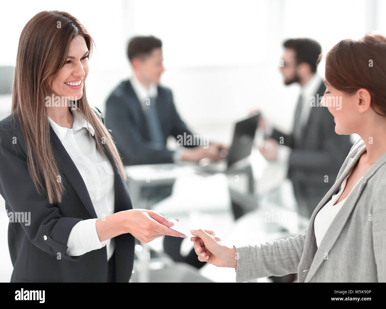 successful business woman gives her business card Stock Photo - Alamy