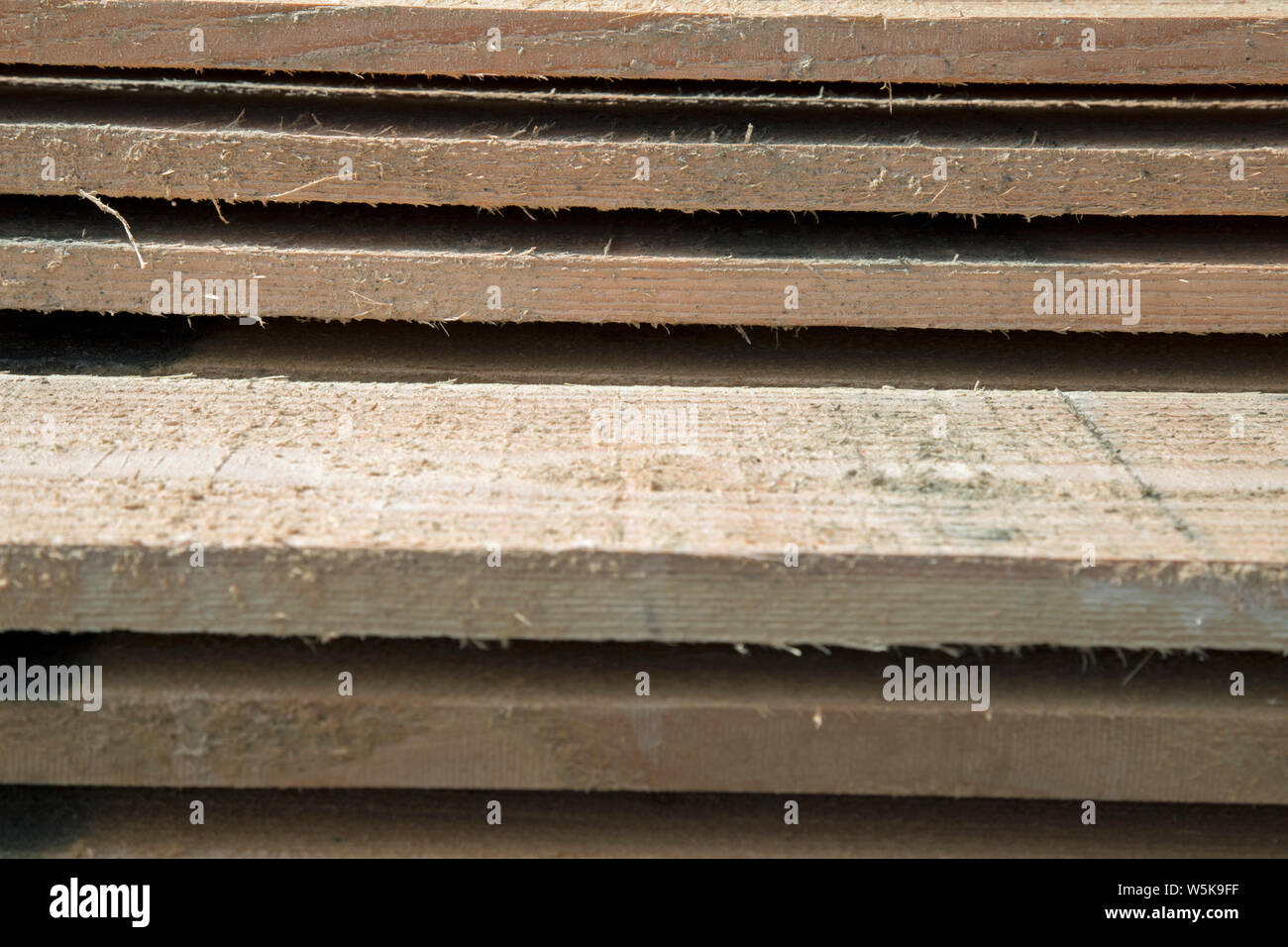 Mill sawn planks of wood in a stack at the windmill, shot close up ...