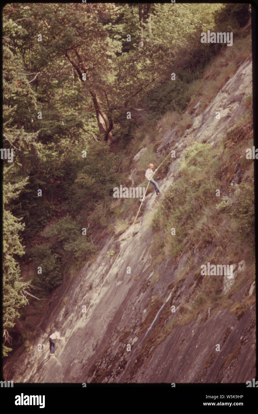 CLIMBERS PRACTICING ON A ROCK WALL AT LARRABEE STATE PARK ON NORTHERN ...