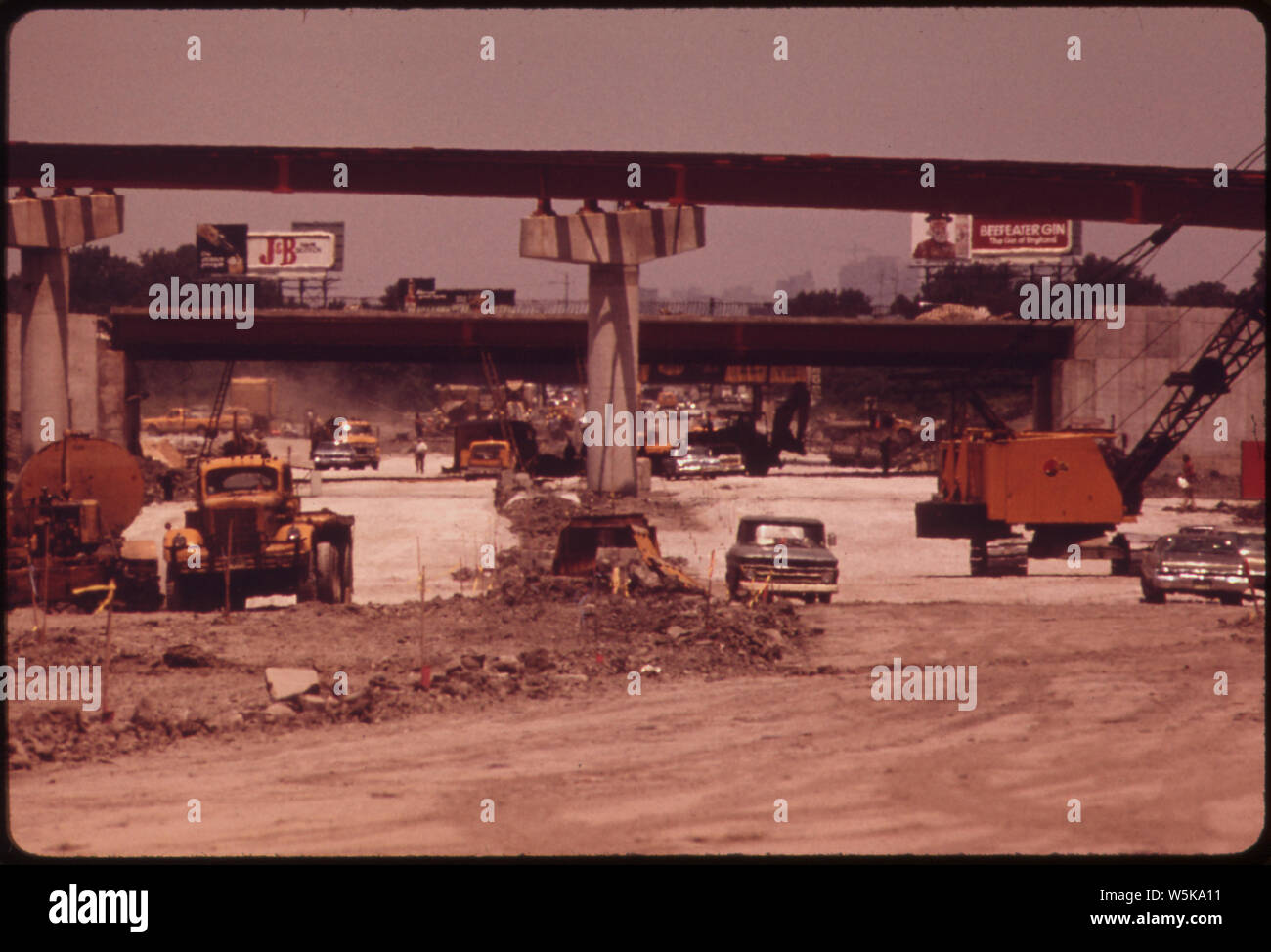 CONSTRUCTION TRUCKS ON 115TH STREET BELOW NEW EXPRESSWAY OVERPASS Stock ...