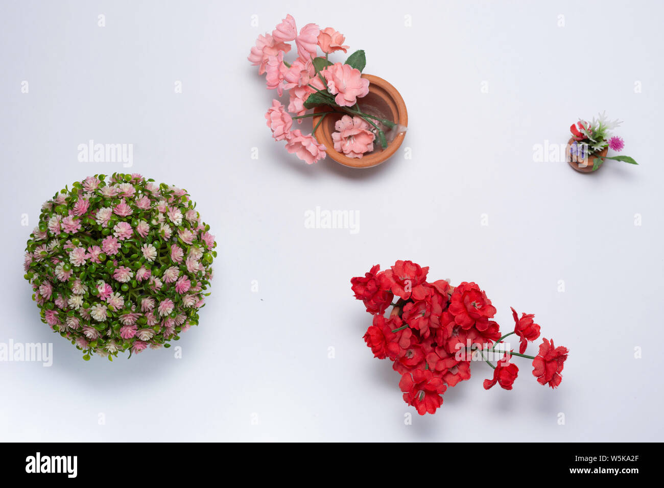 Plastic Flower decaration on withe background Stock Photo - Alamy