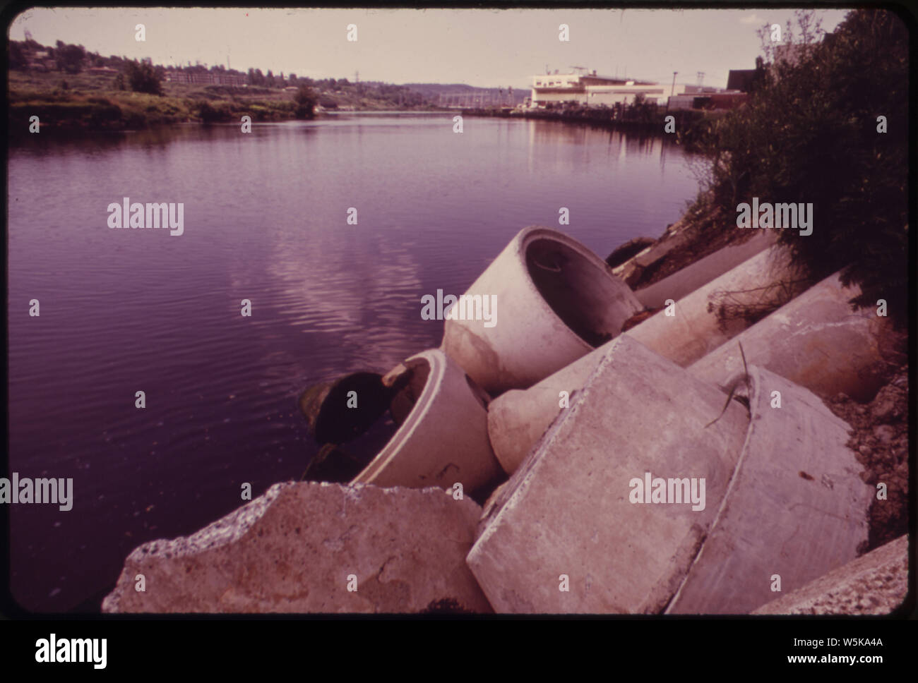 CULVERT PIPE AND CABLES DUMPED AS RIPRAP (A HAPHAZARD SUSTAINING WALL ...