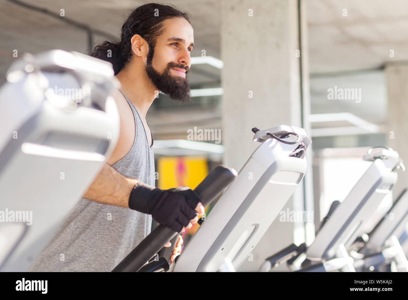 Closeup side view portrait of successful young adult sport man with ...
