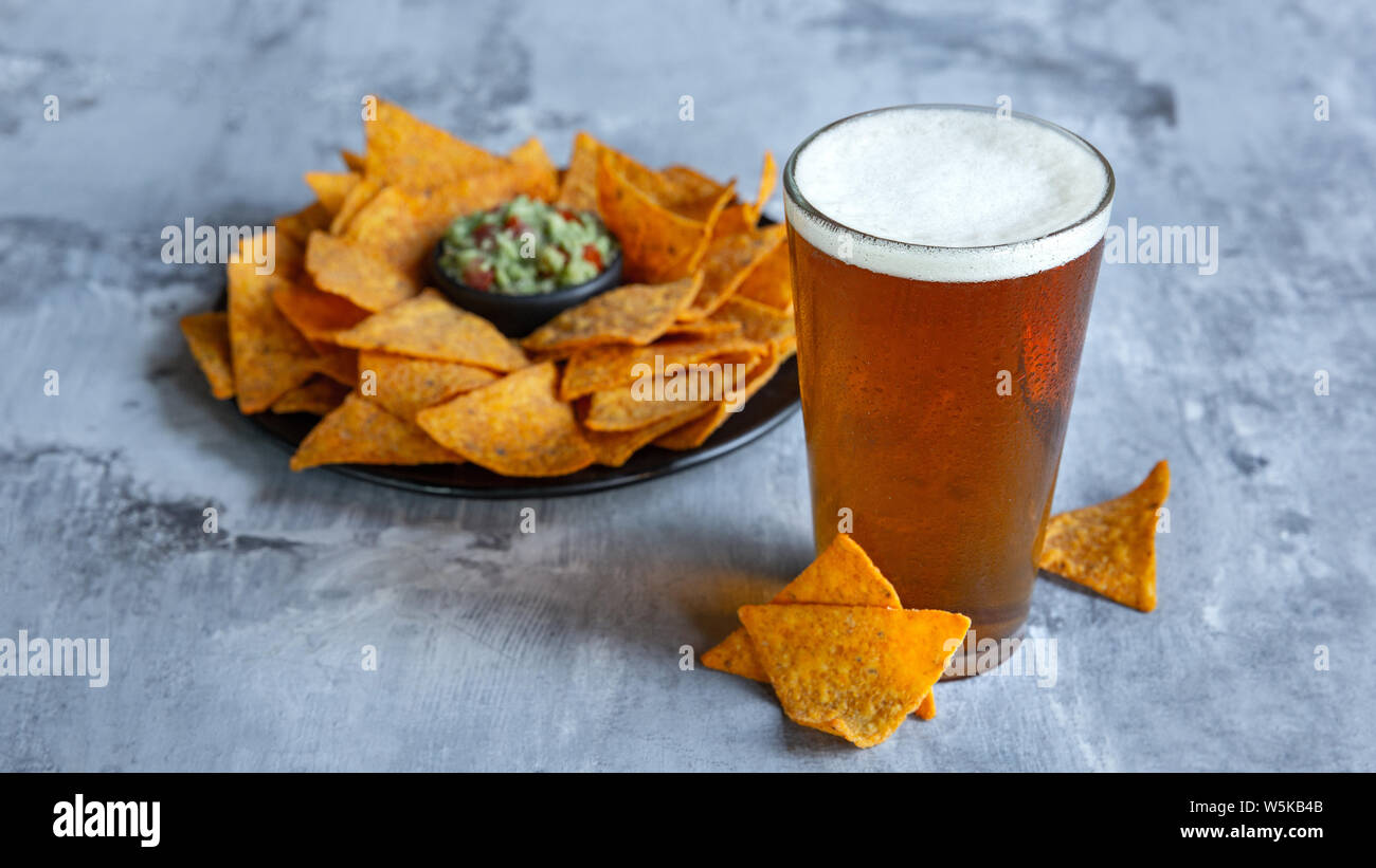 Glass of light beer on white stone background. Cold alcohol drink and ...