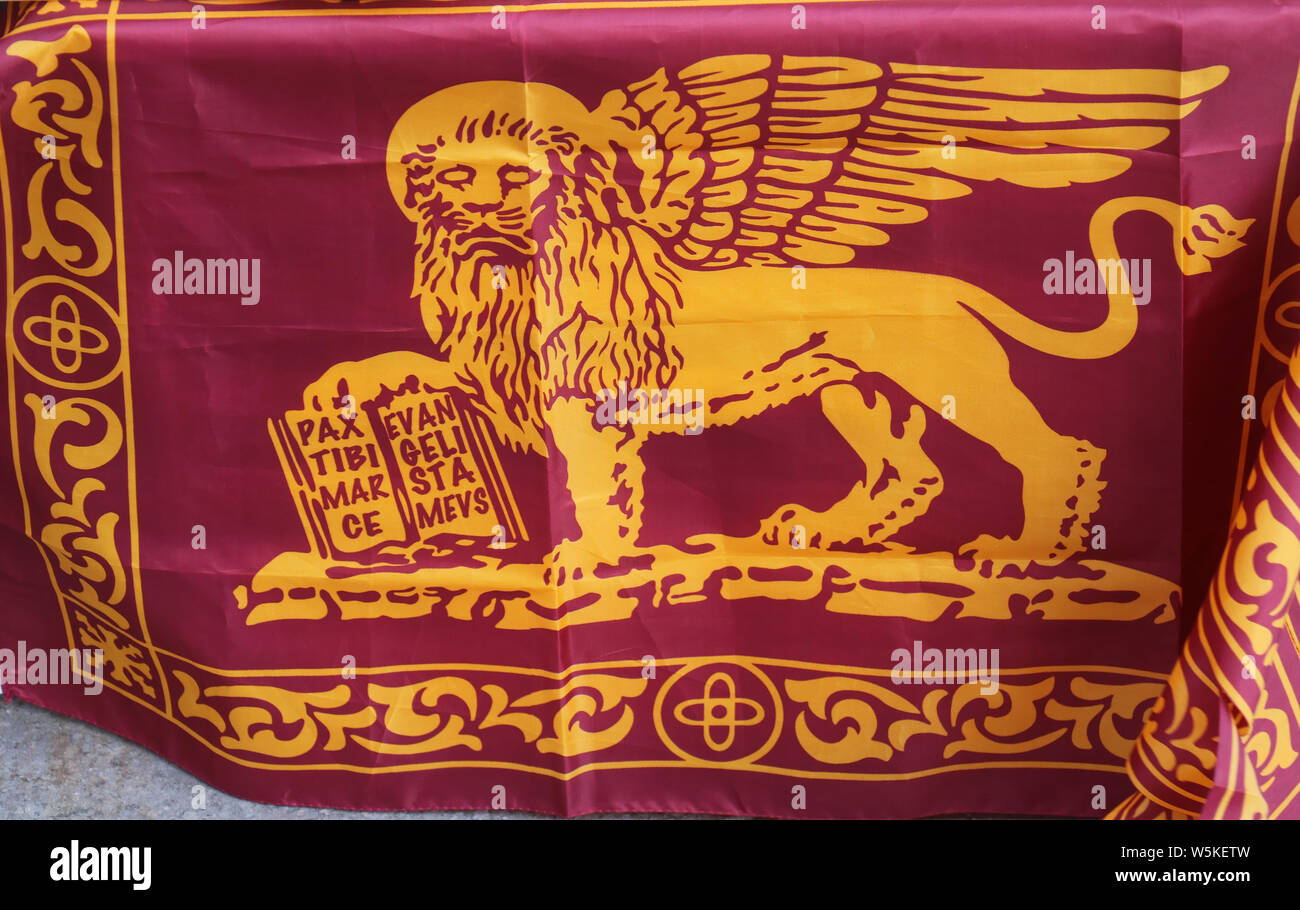 Old traditional Venice national flag on building wall Stock Photo - Alamy