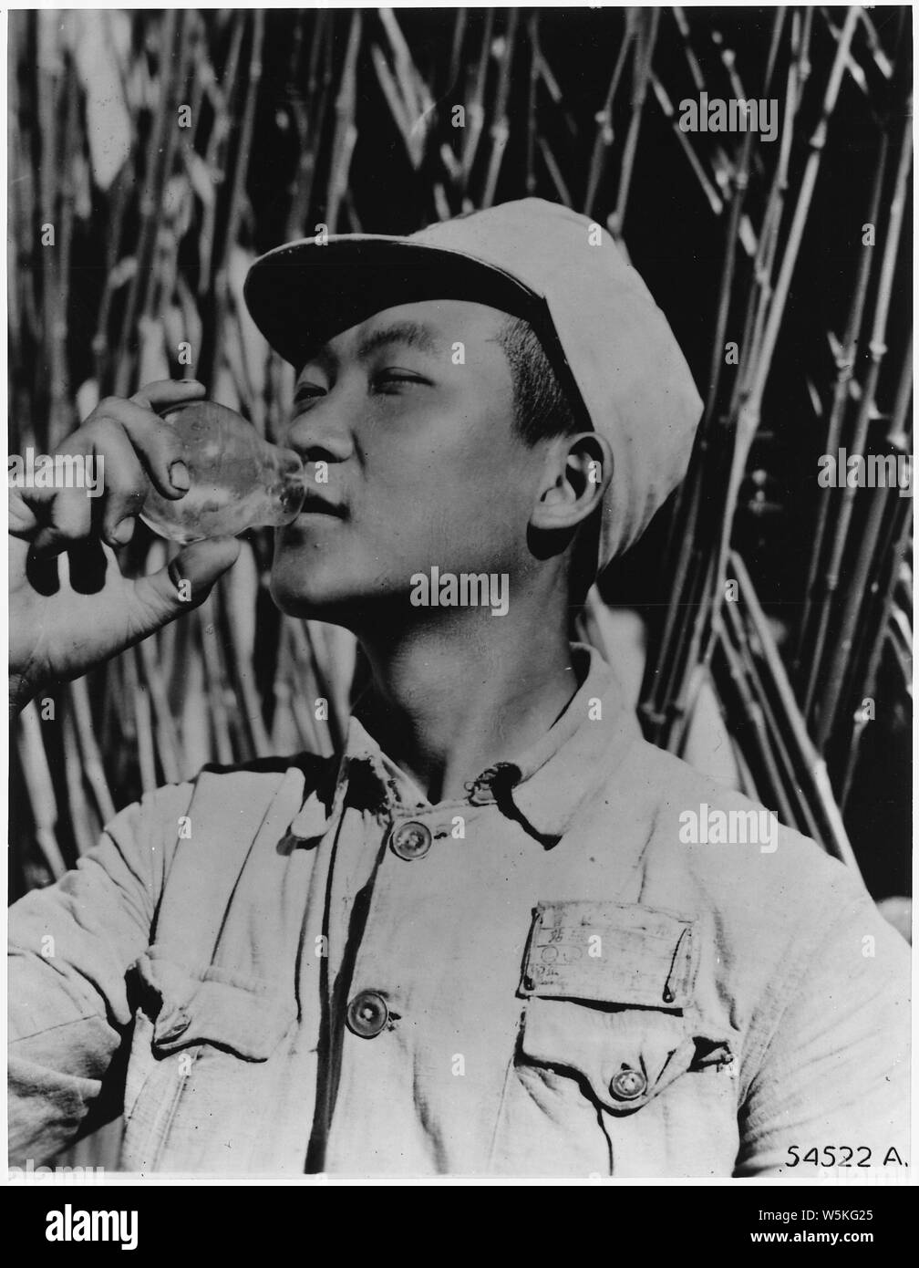 Chinese workman at the U.S. Army 14th Air Force Headquarters uses the ...