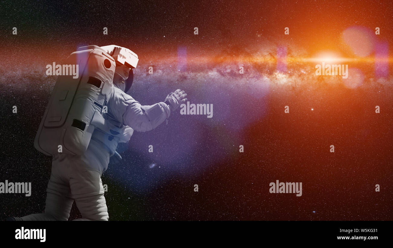astronaut in outer space flying towards the stars Stock Photo - Alamy