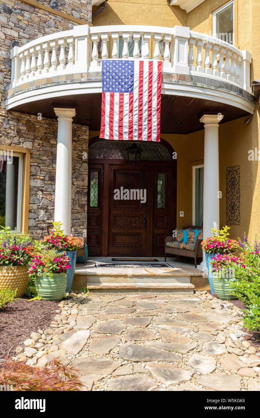 American flag front of house hi-res stock photography and images - Alamy