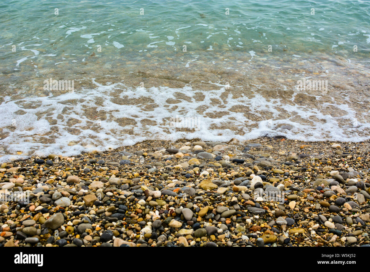 Pebble shore of French Riviera in Nice, natural background Stock Photo ...