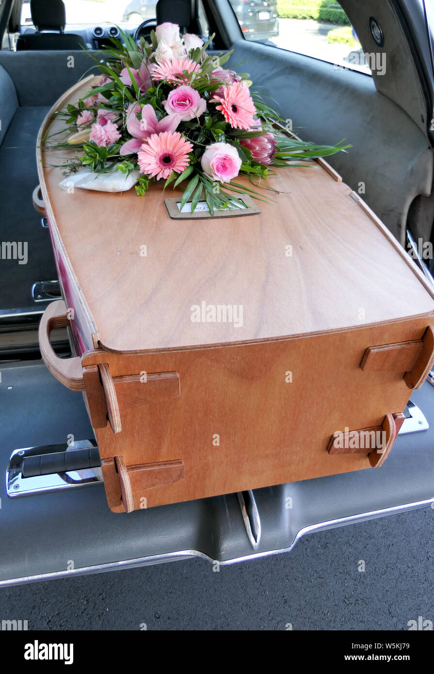 closeup shot of a funeral casket in a hearse or chapel or burial at ...