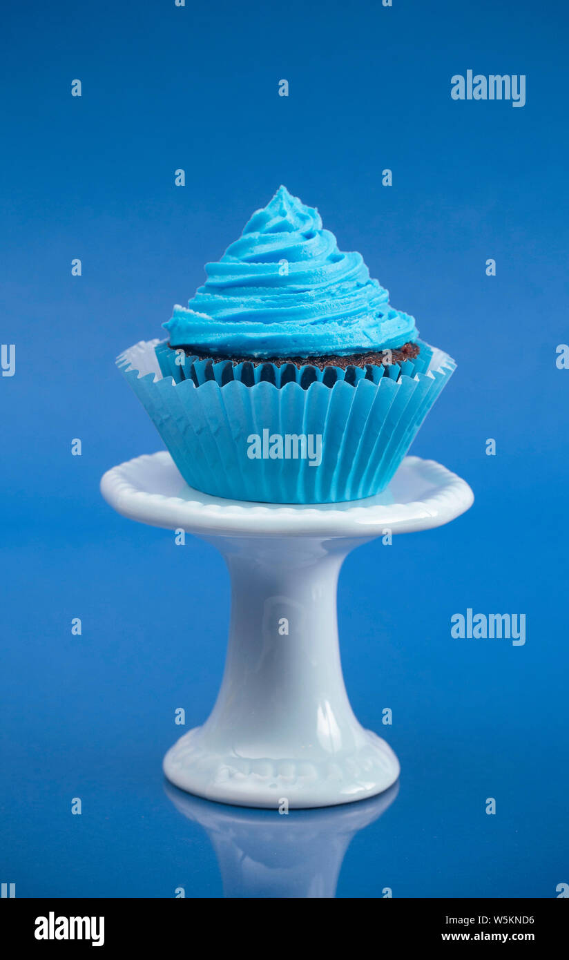 Single Blue Cupcake on a Stand Stock Photo - Alamy