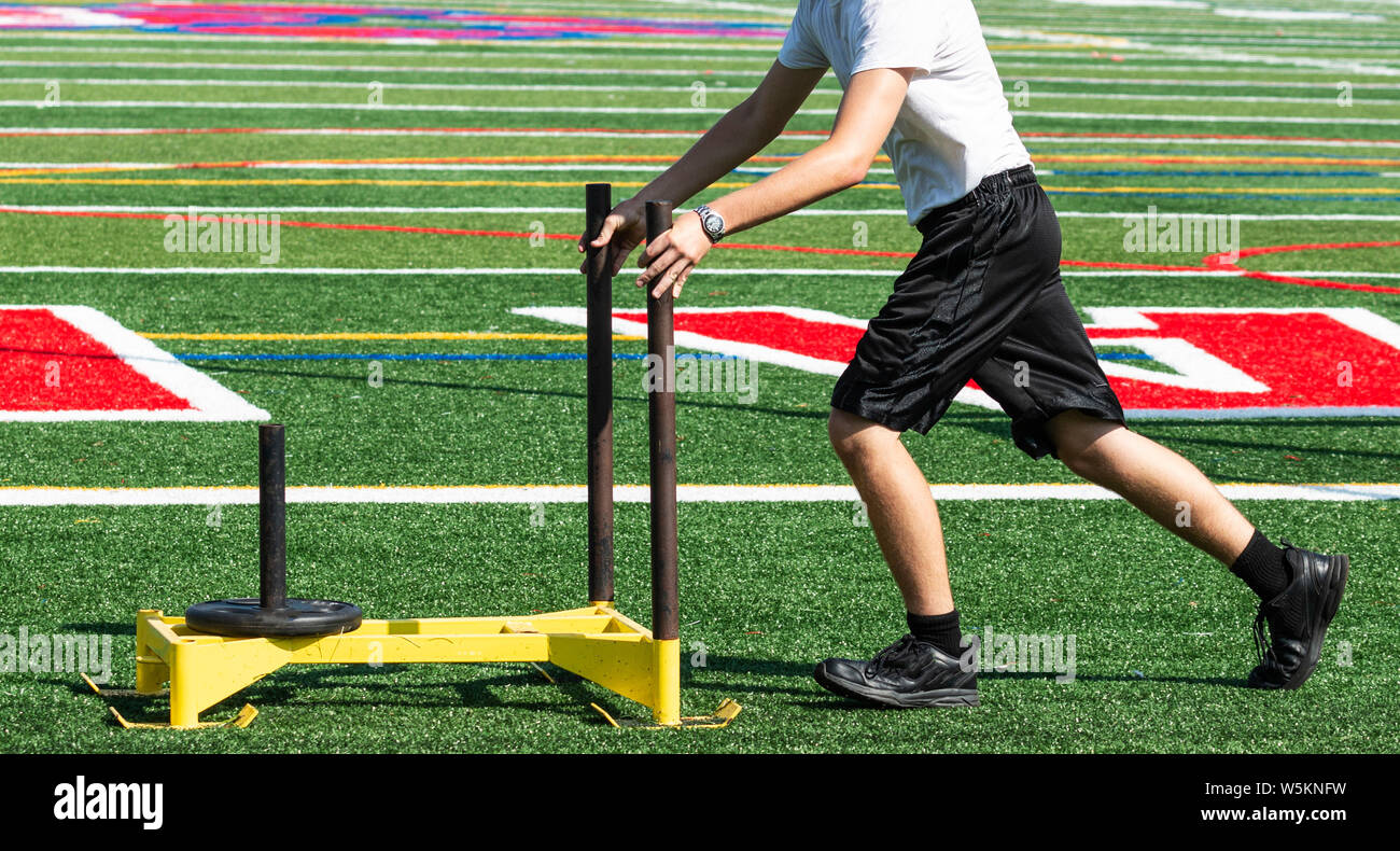 Boy pushing sled hi-res stock photography and images - Alamy