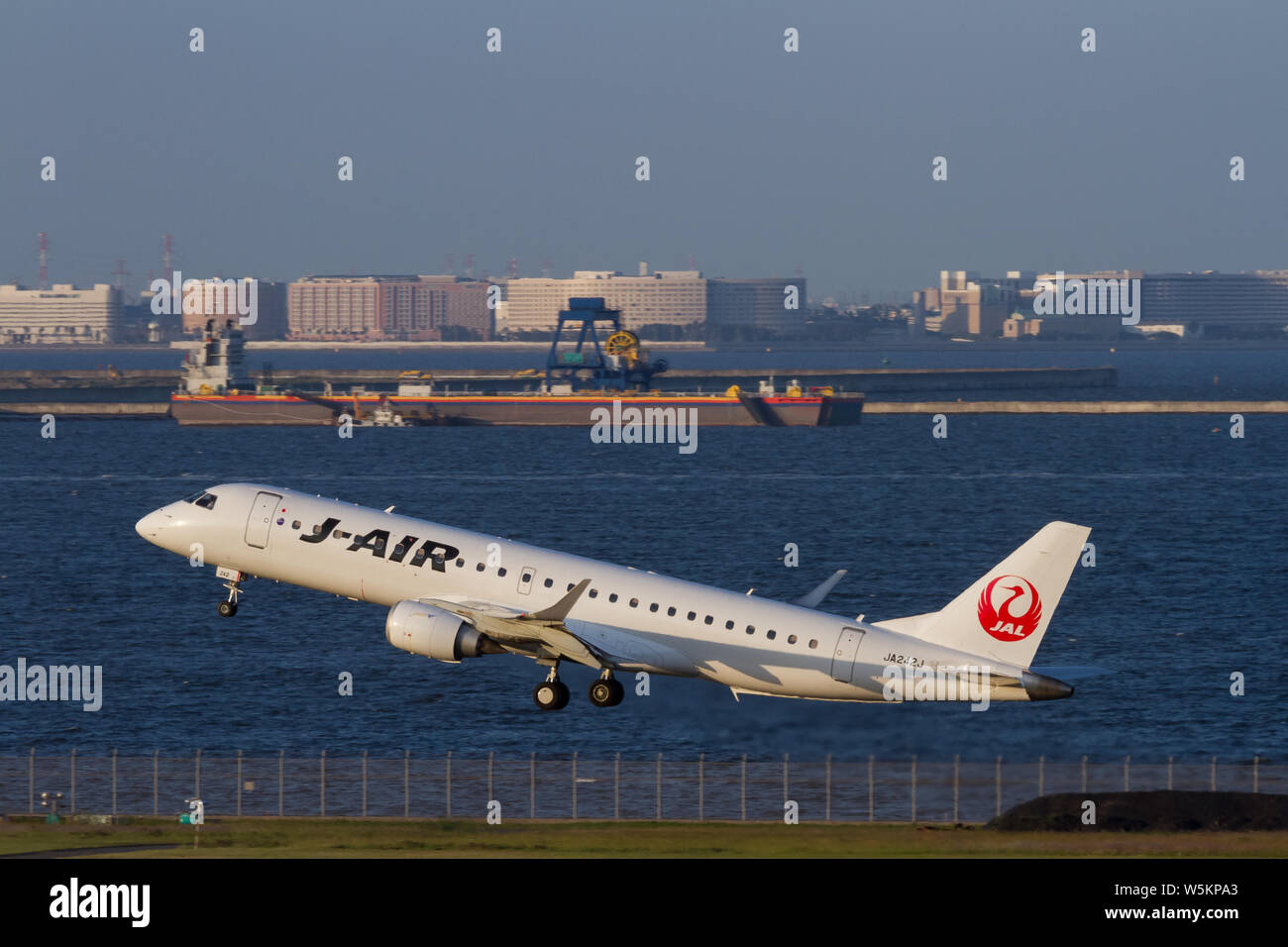 A japan Airlines (JAL) Embraer 190-100STD airliner takes off from ...