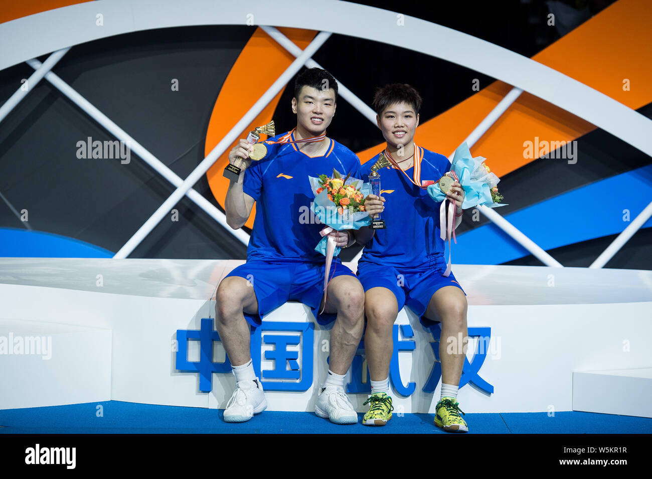 Wang Yilyu and Huang Dongping of China pose with their trophies after ...