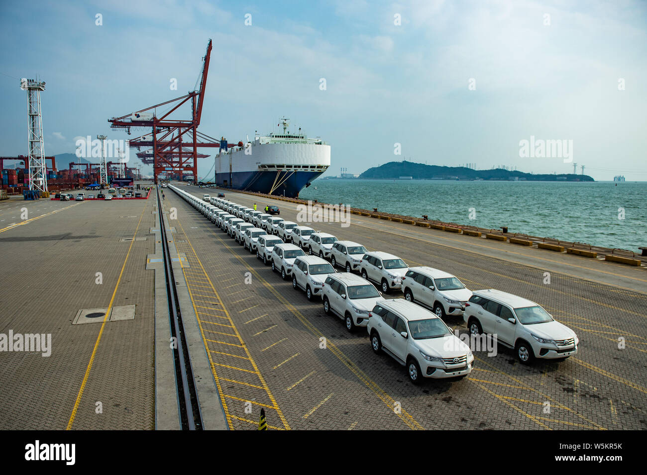 A total of 500 parallel-import SUVs of Toyota are lined up at a port in ...