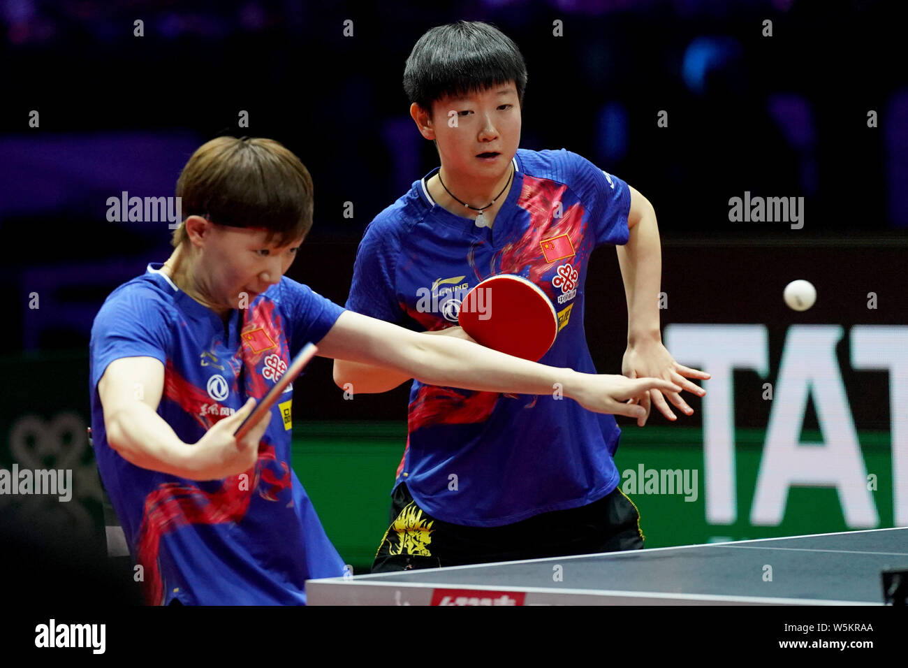 Sun Yingsha and Wang Manyu of China return a shot to Hina Hayata and ...