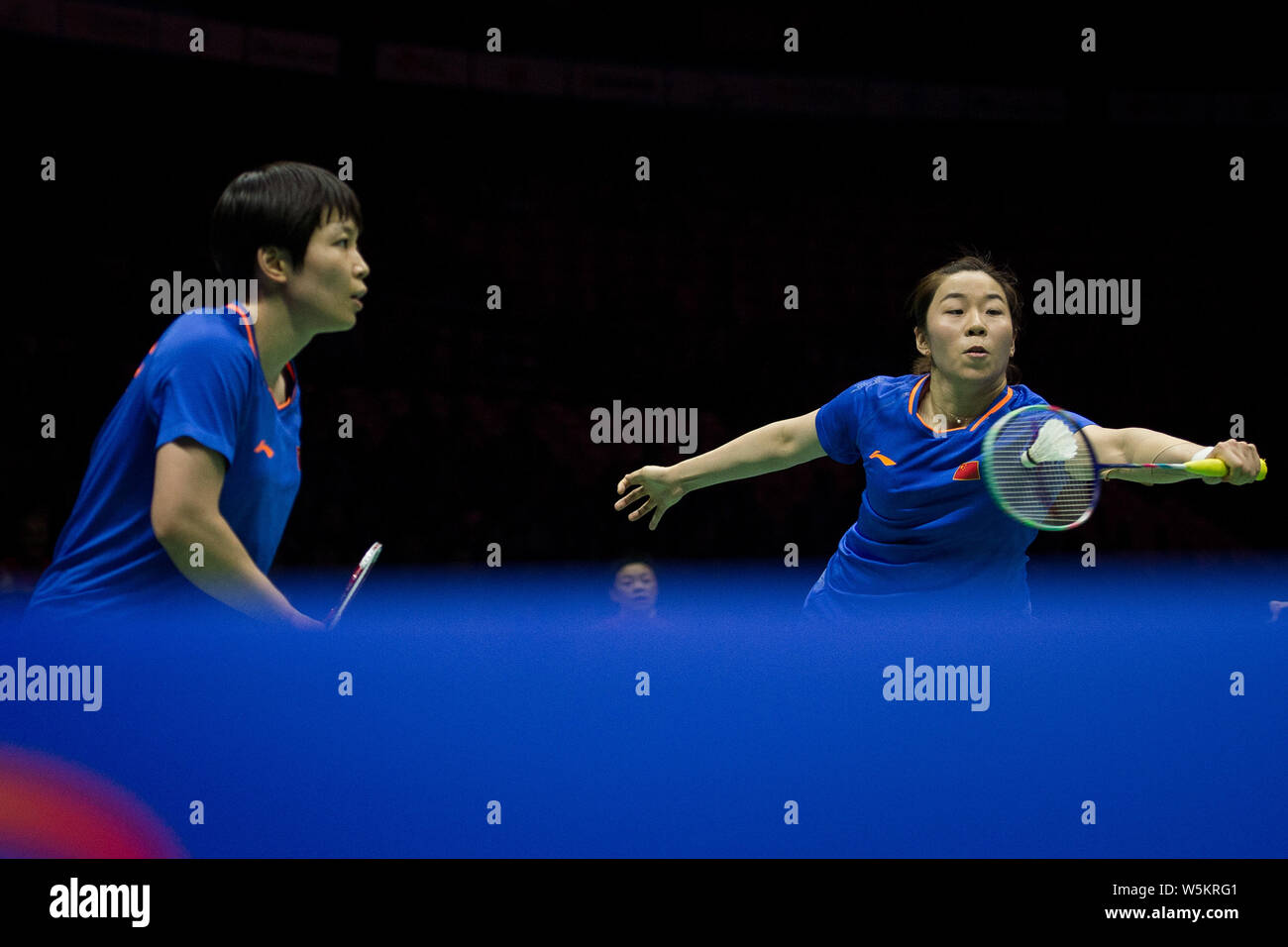 Chen Qingchen and Jia Yifan of China return a shot to Mayu Matsumoto and Wakana Nagahara of ...