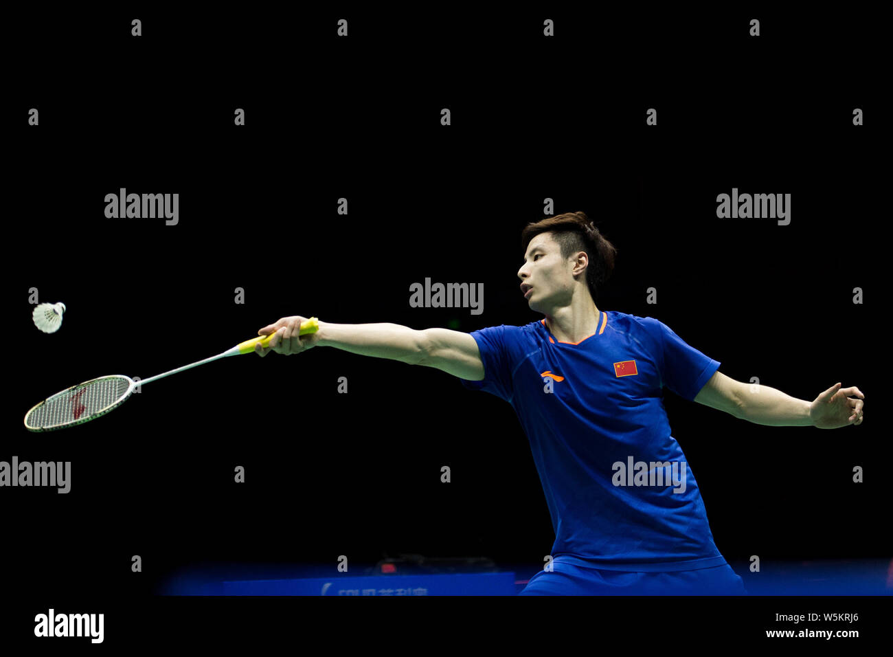 Shi Yuqi of China returns a shot to Kento Momota of Japan in their final match of men's singles ...