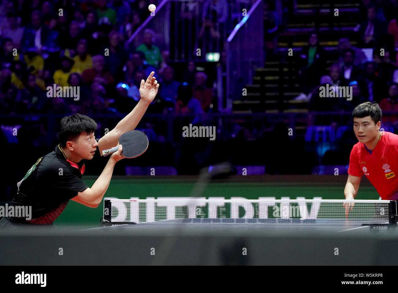 Ma Long of China serves against Liang Jingkun of China in their ...