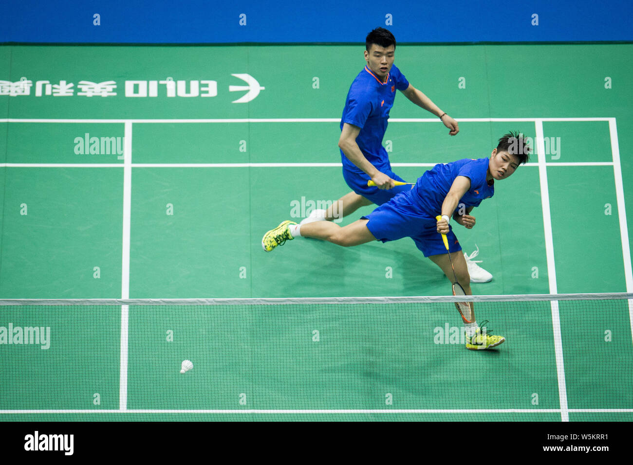 Wang Yilyu and Huang Dongping of China return a shot to He Jiting and ...