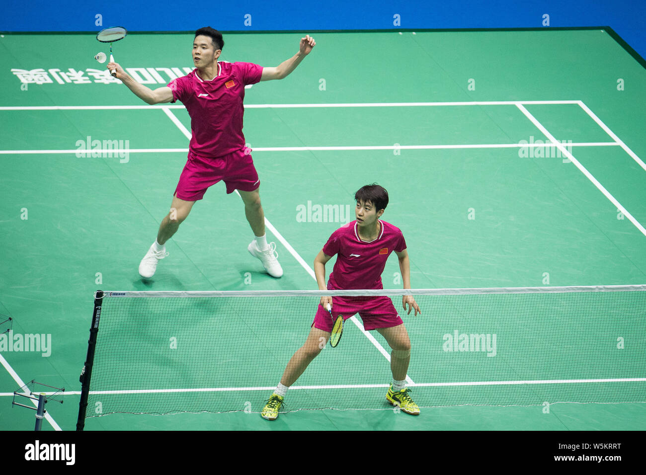He Jiting and Du Yue of China return a shot to Wang Yilyu and Huang ...