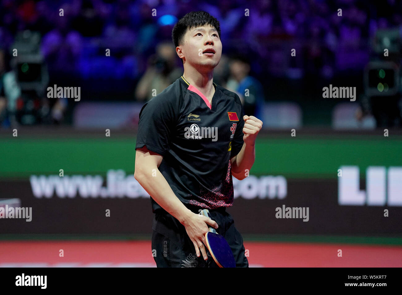 Ma Long of China celebrates after scoring against Liang Jingkun of ...