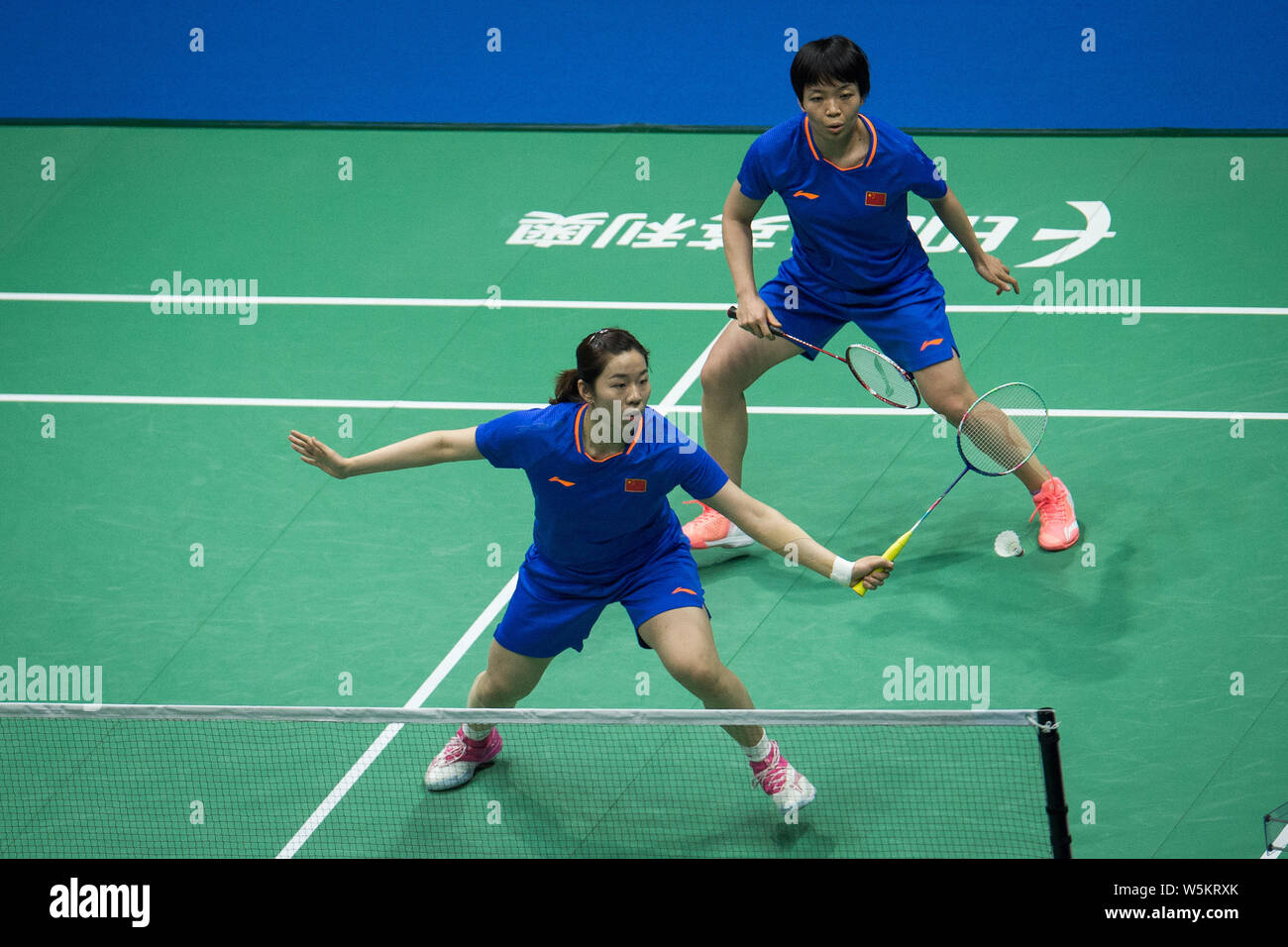 Chen Qingchen And Jia Yifan Of China Return A Shot To Mayu Matsumoto And Wakana Nagahara Of