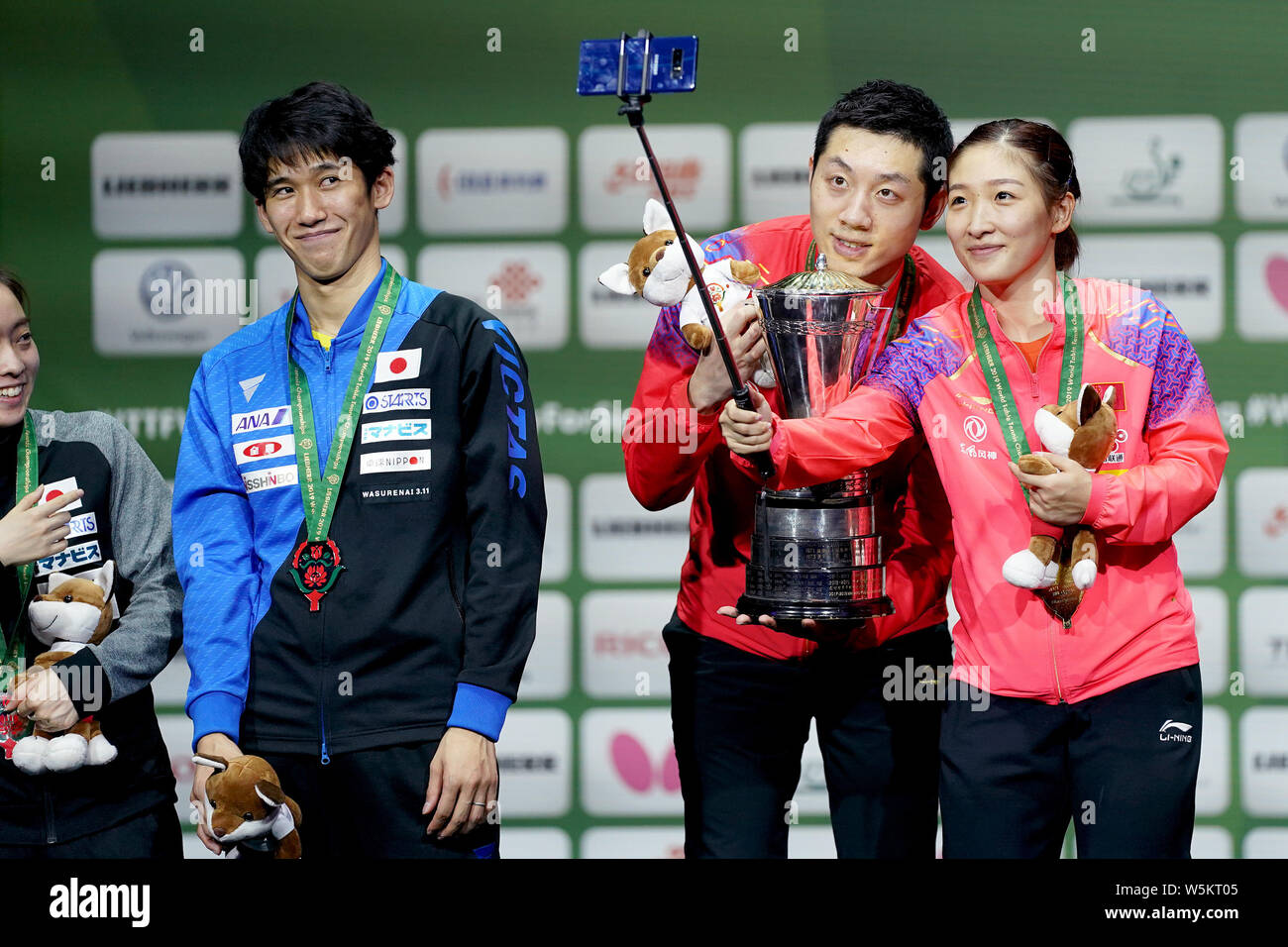 Xu Xin and Liu Shiwen of China poses with their trophy after defeating ...